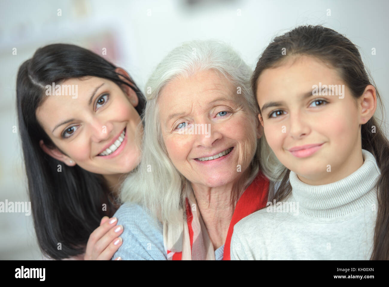 happy family of three generations smiling and looking at camera Stock ...