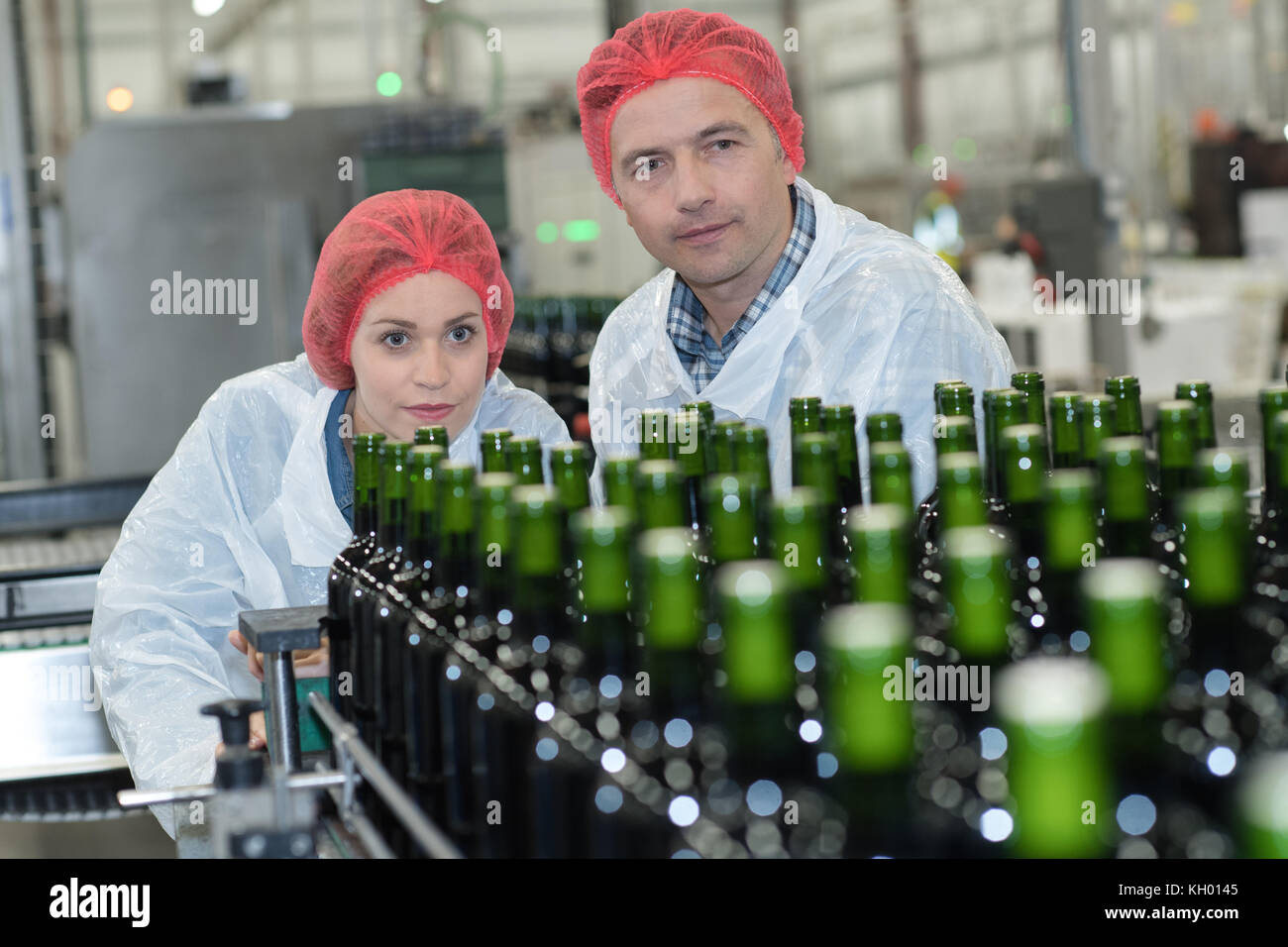 brewery line factory workers Stock Photo - Alamy