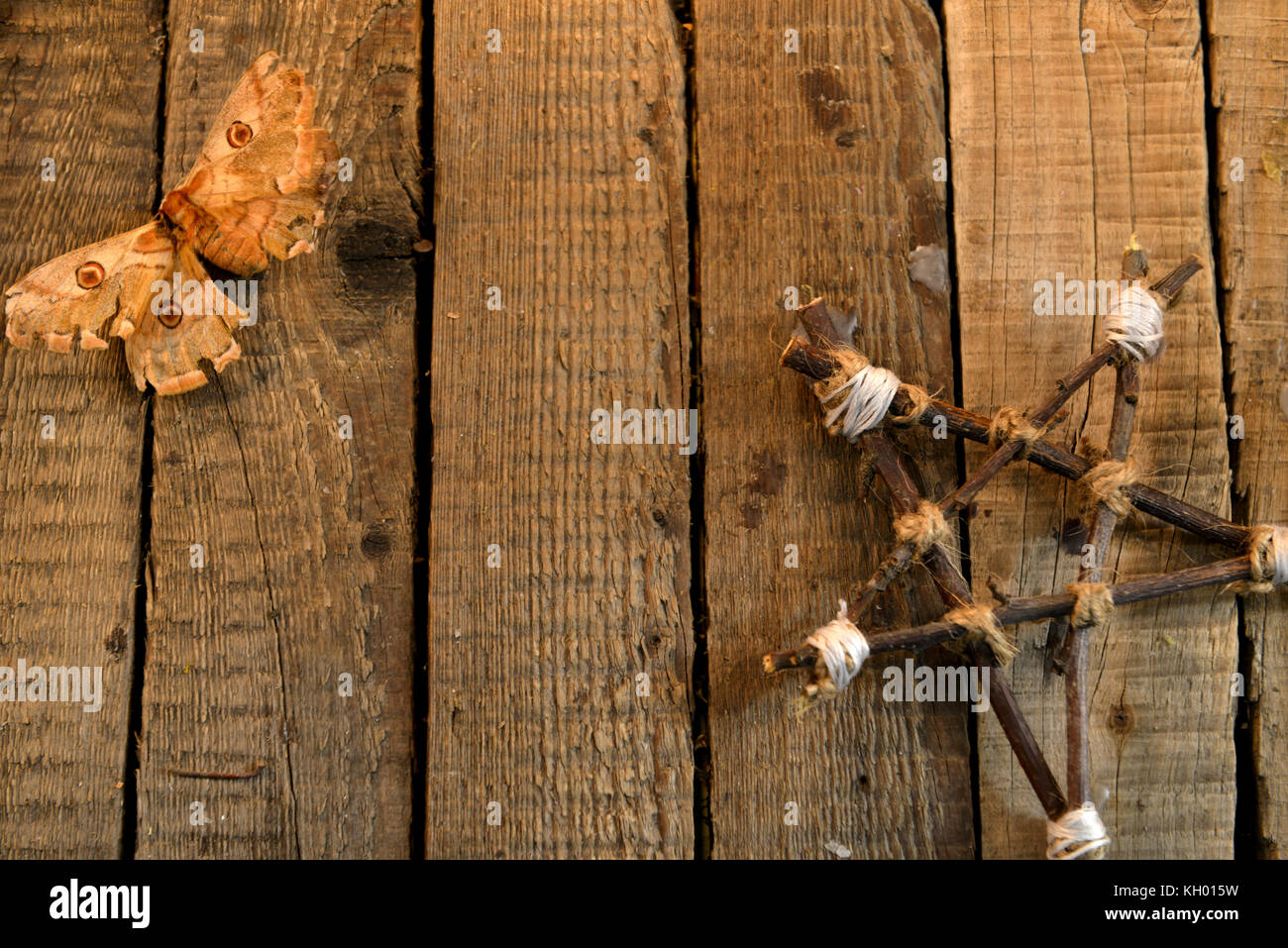 Wooden pentagram and moth on witch table, with copy space Stock Photo ...