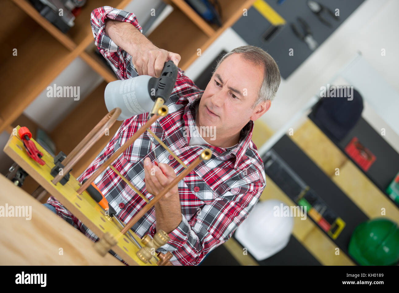 industrial plumber using blowtorch Stock Photo - Alamy