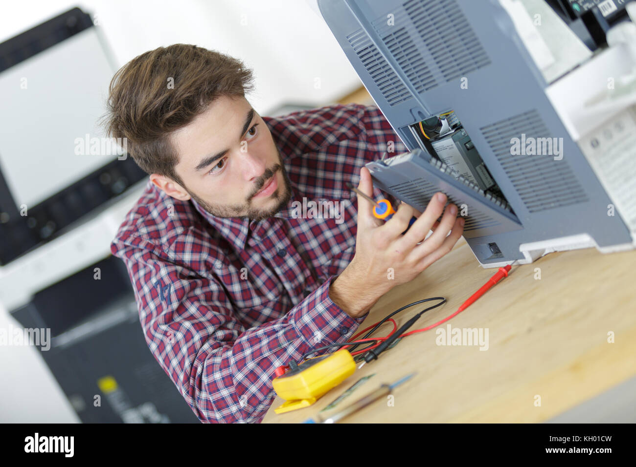 computer repairman solving problem in main-board Stock Photo - Alamy
