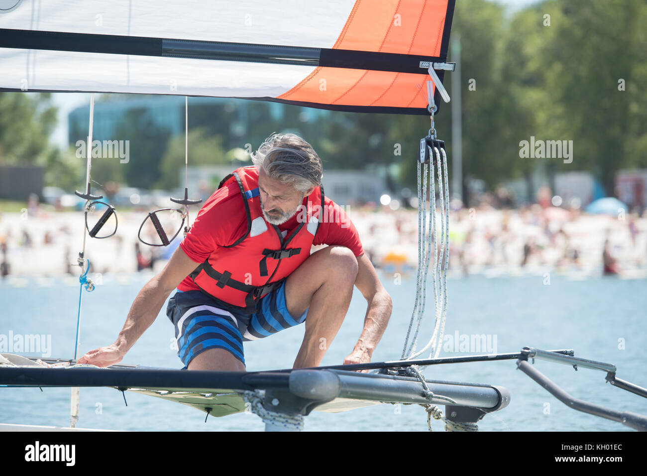 professional waterman training on lake with catamaran Stock Photo - Alamy