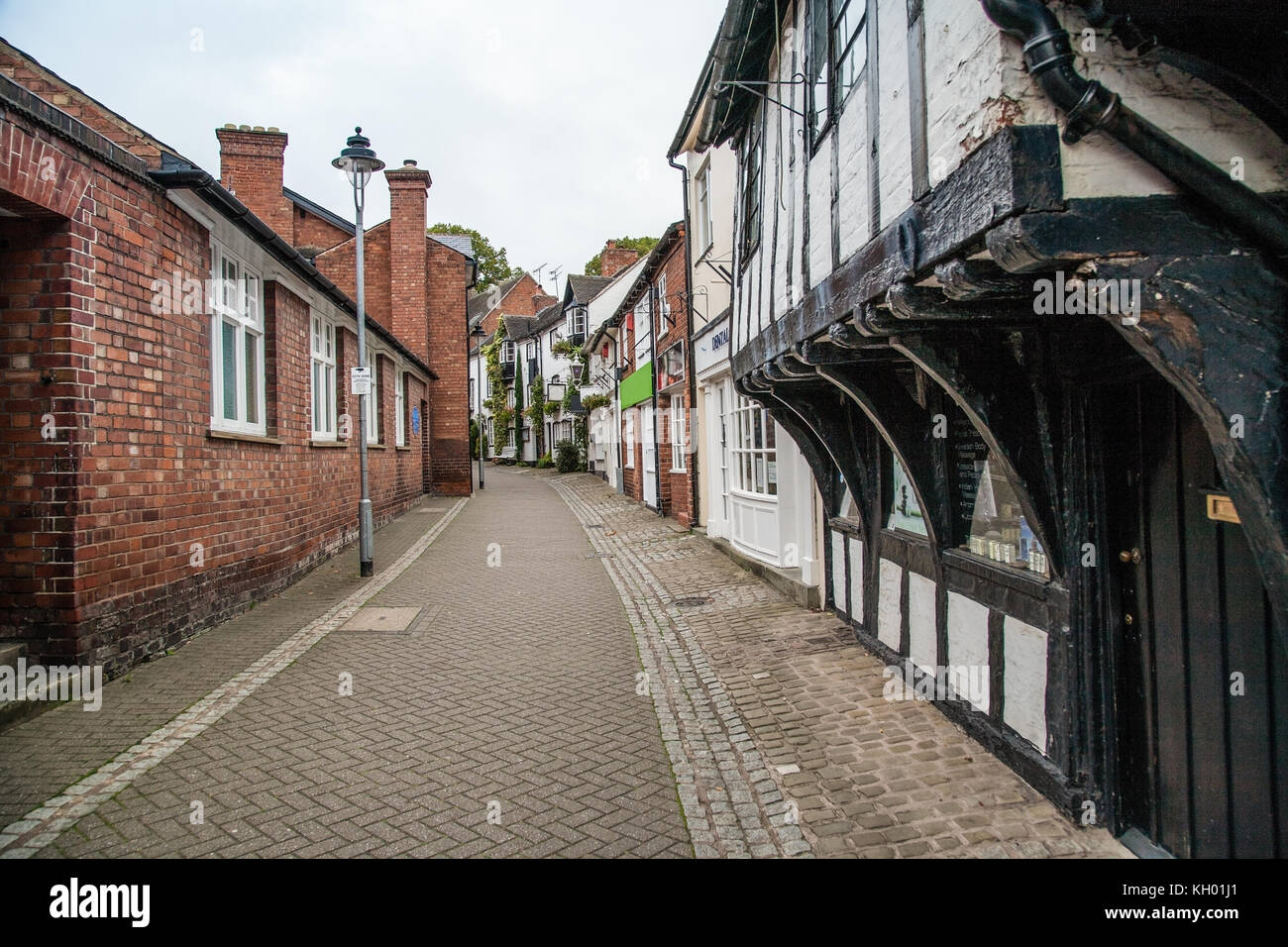An old passage street with black and white half timbered buildings St ...