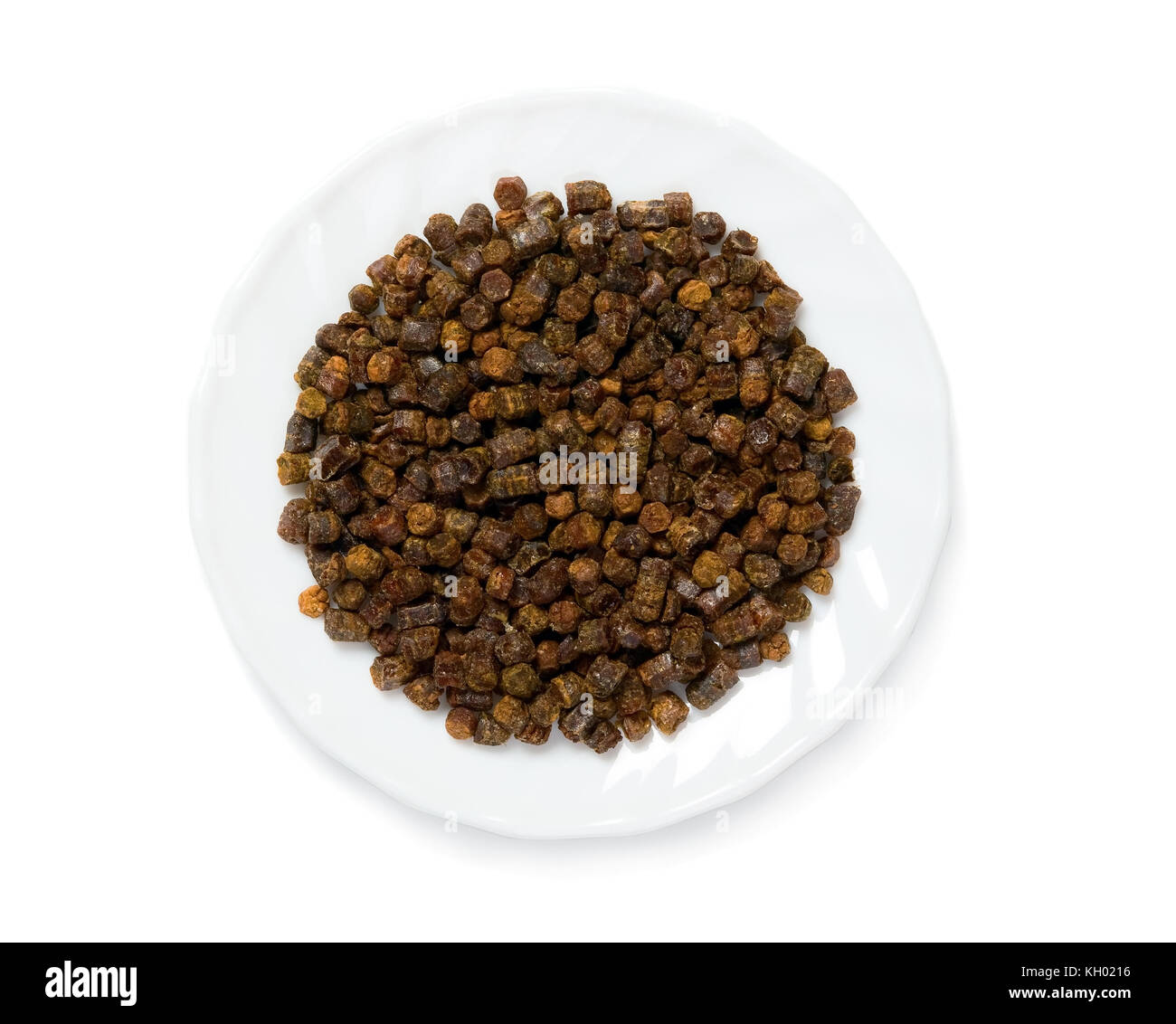 Propolis granules inside plate on background, bee product Stock Photo ...