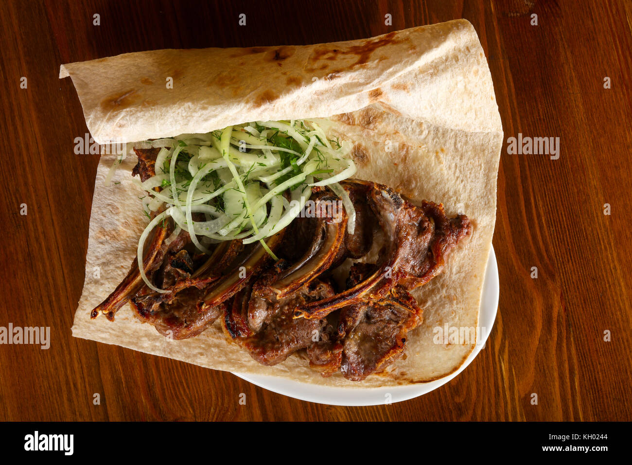 Lamb kebab ribs served onion Stock Photo - Alamy