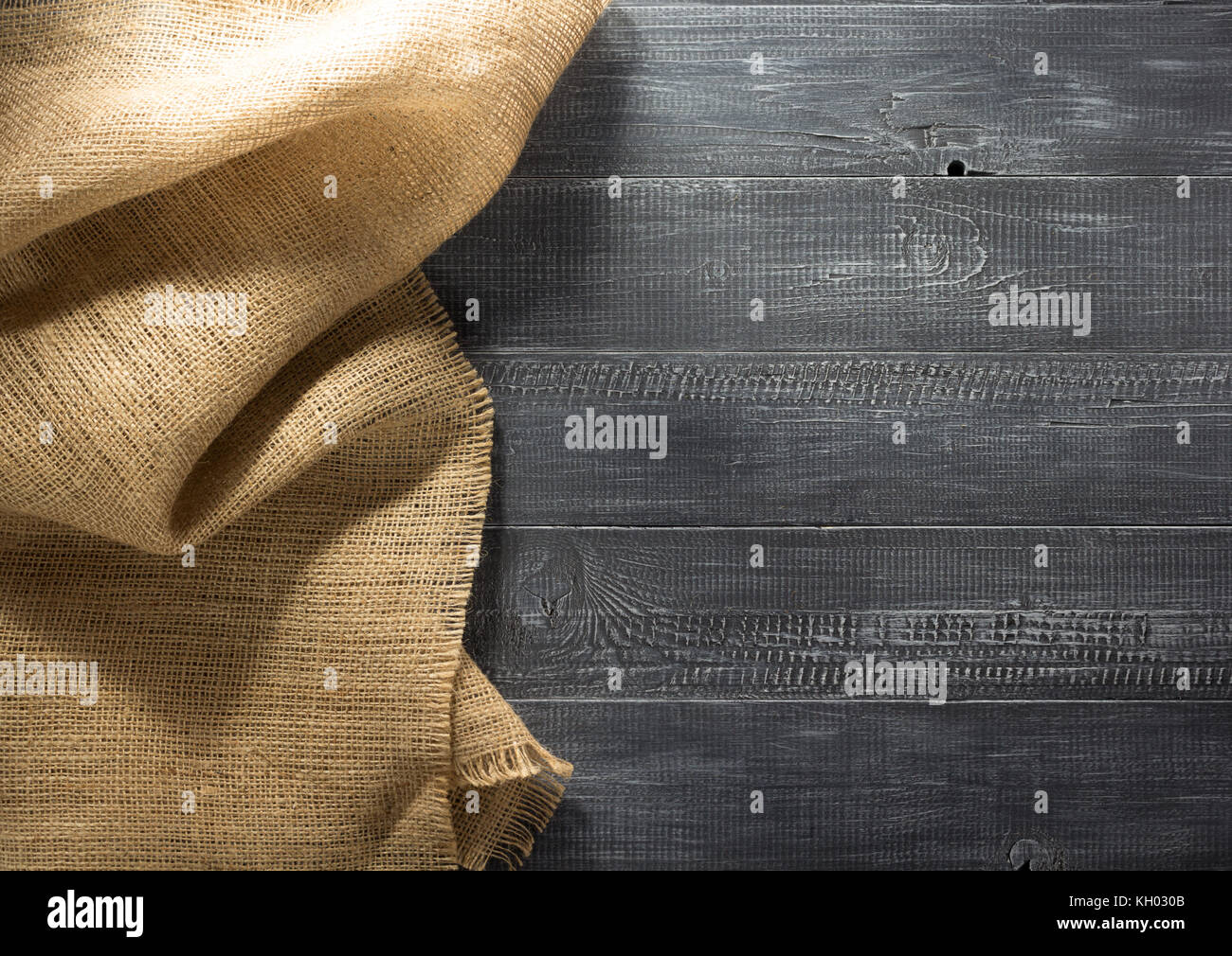 burlap hessian sacking on wooden background Stock Photo - Alamy