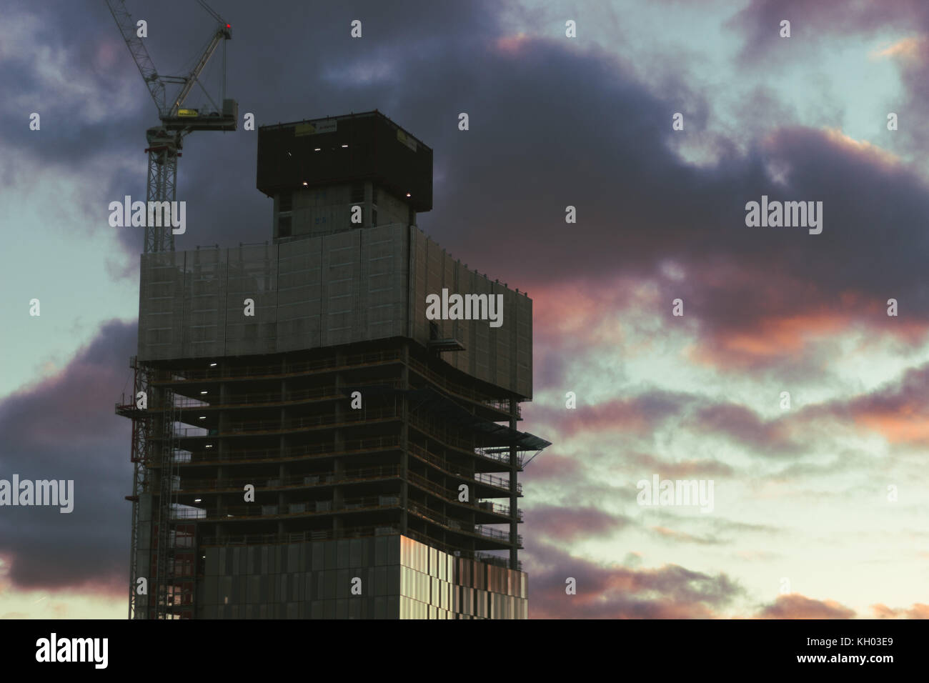 unfinished buildings in the city at sunset with reflections Stock Photo ...