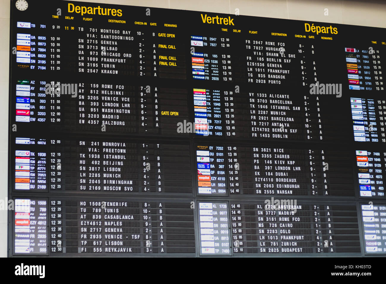 flight board split flap checker in airport showing flights Stock Photo ...