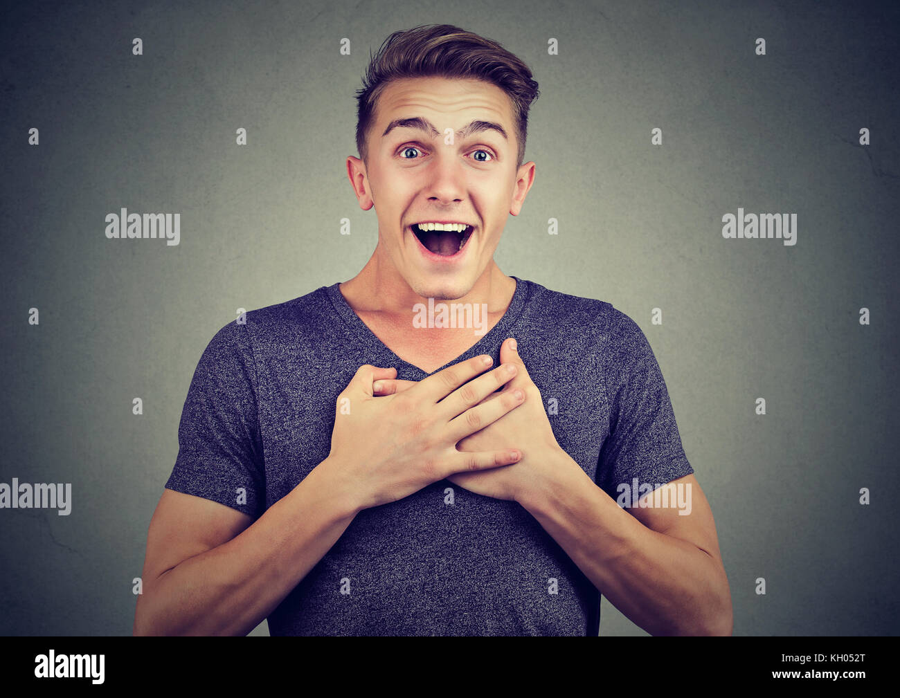 Surprised happy young man looking at camera Stock Photo - Alamy