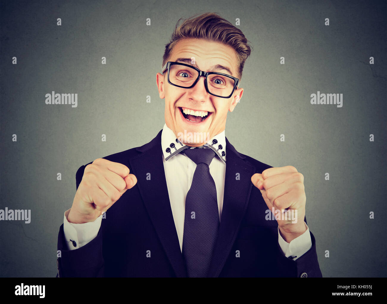 Happy excited young man in glasses Stock Photo - Alamy