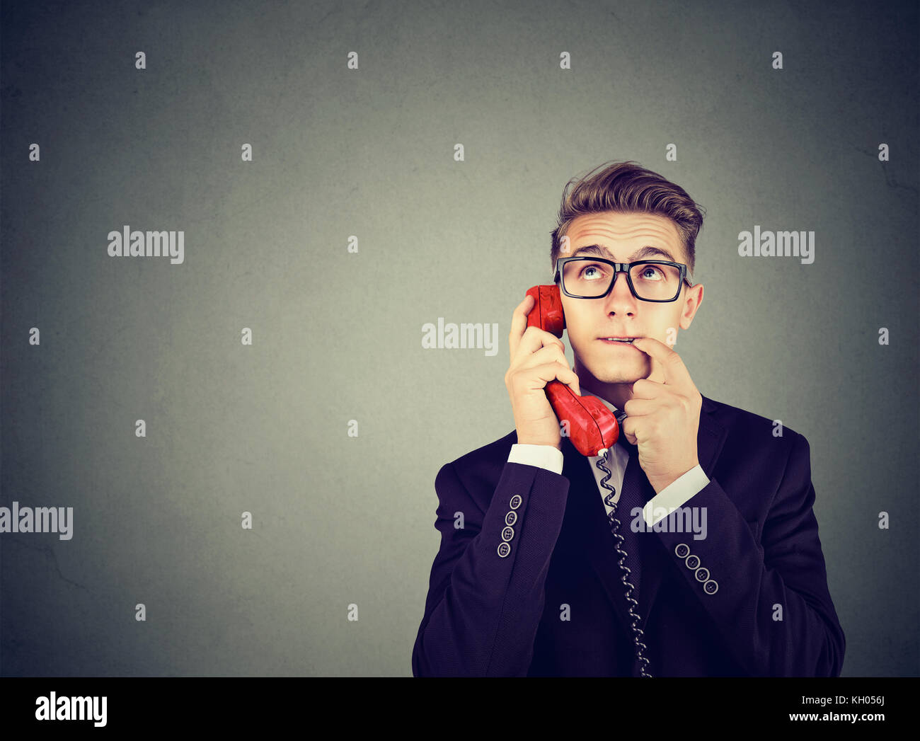 Misunderstanding and distant call. Upset worried confused man talking ...