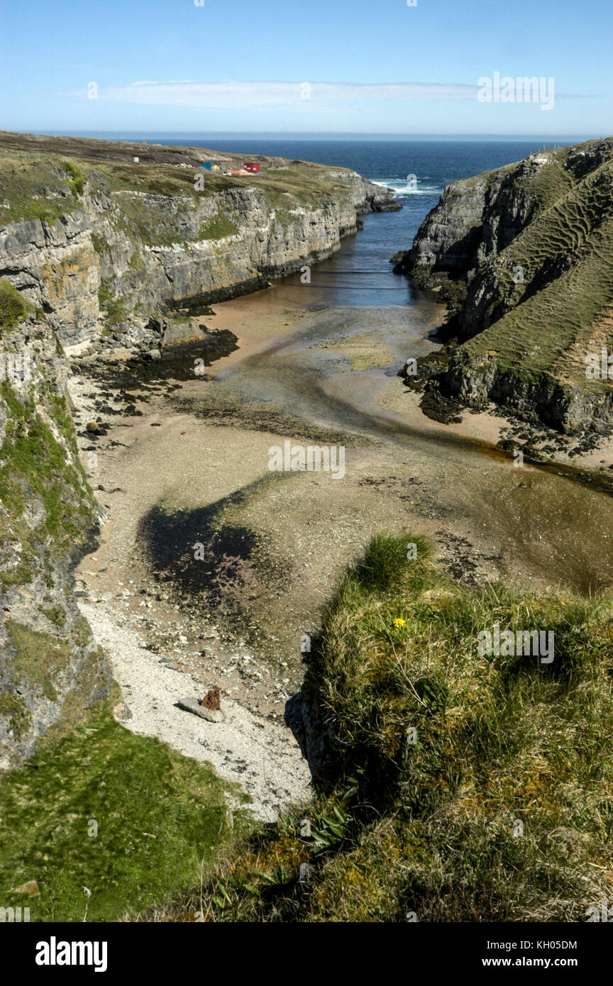 The sea inlet to Smoo Cave is a large combined sea cave and freshwater ...