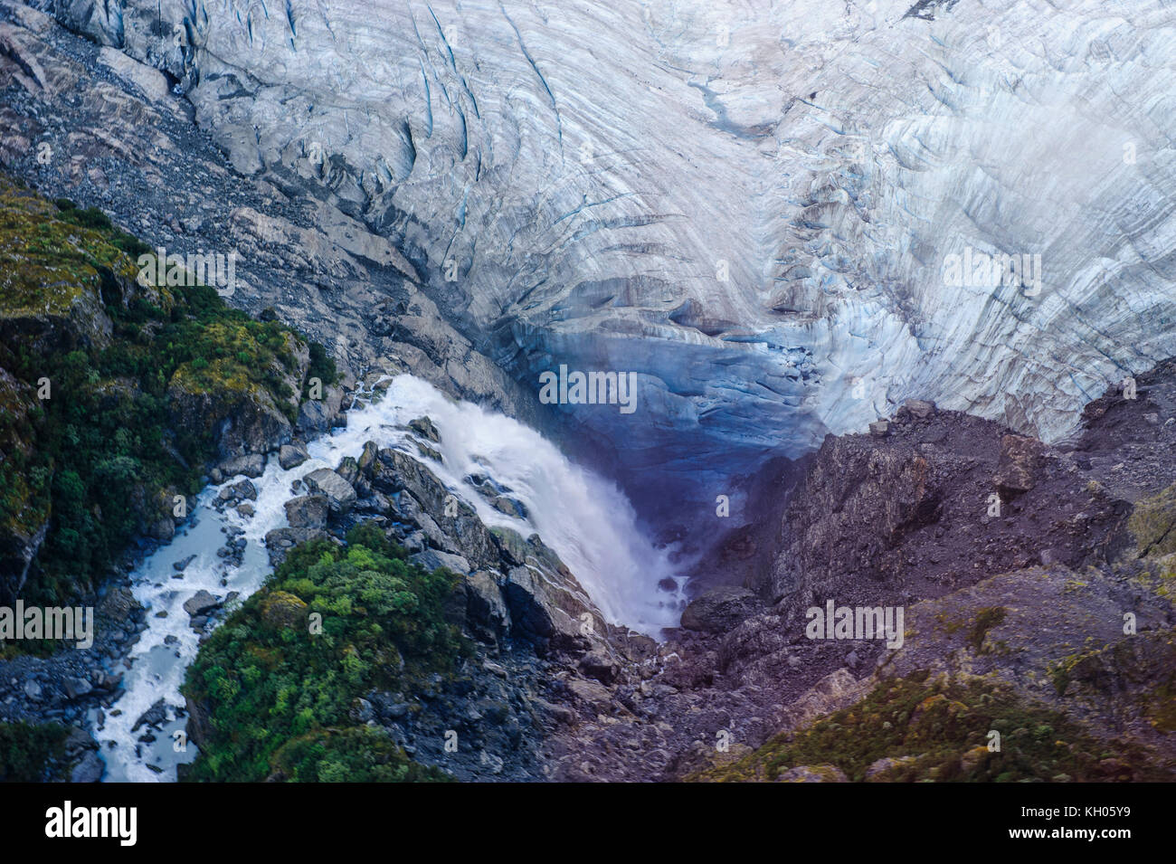 Aerial view of a waterfall falling into fox glacier hi-res stock ...