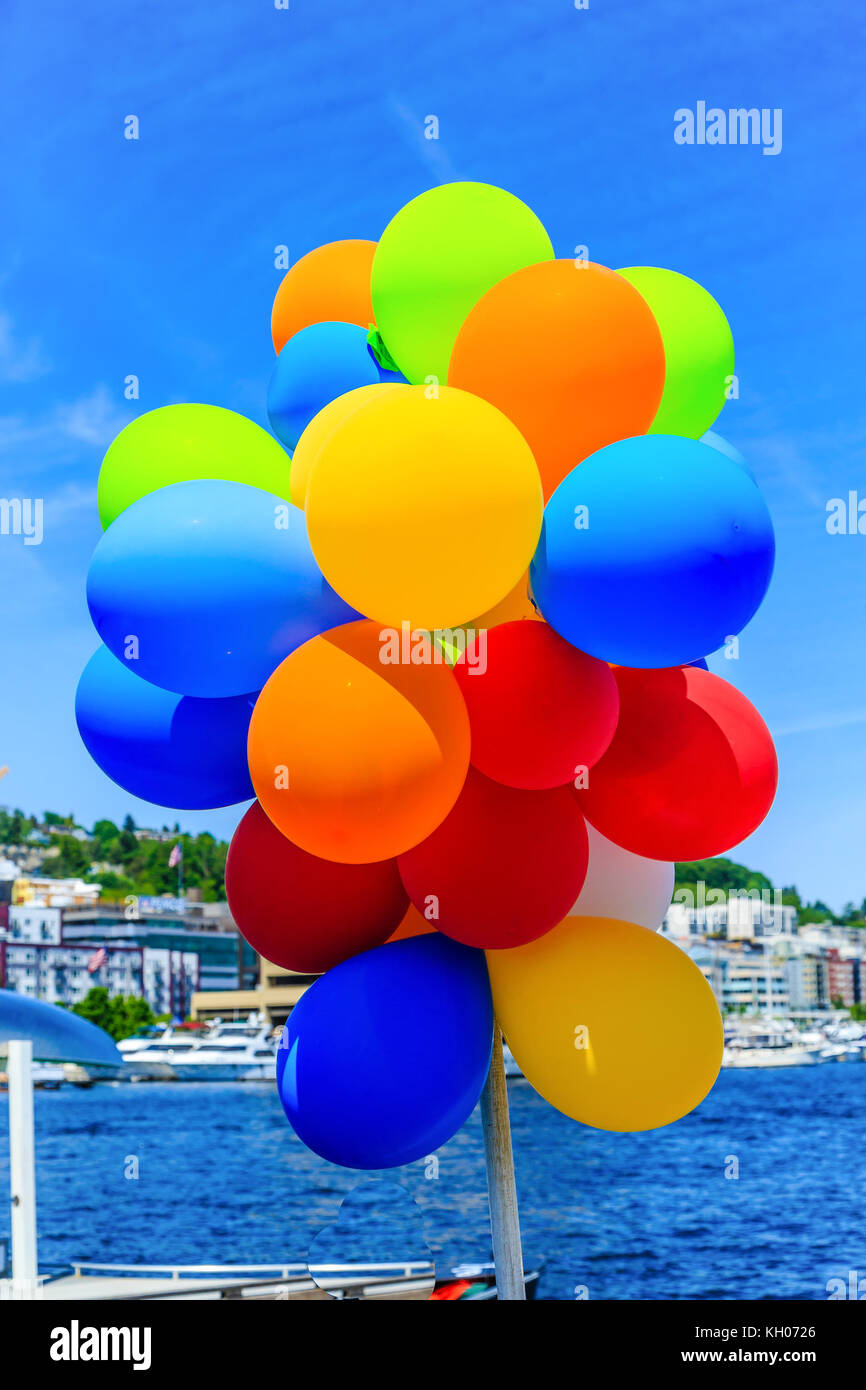 Many Colored Helium Balloons by the Water Stock Photo - Alamy