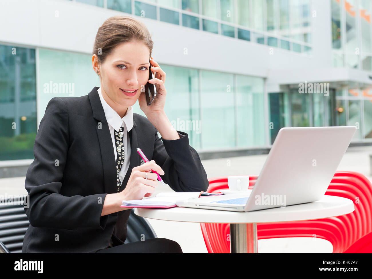Young business woman working Stock Photo - Alamy