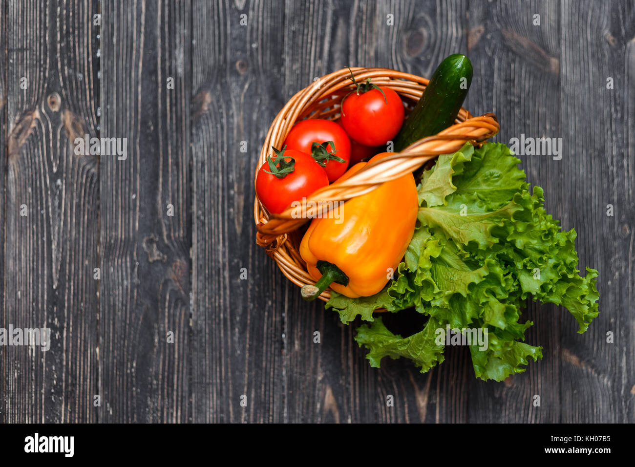Basket with fresh vegetables on a rustic table. View from above Stock ...