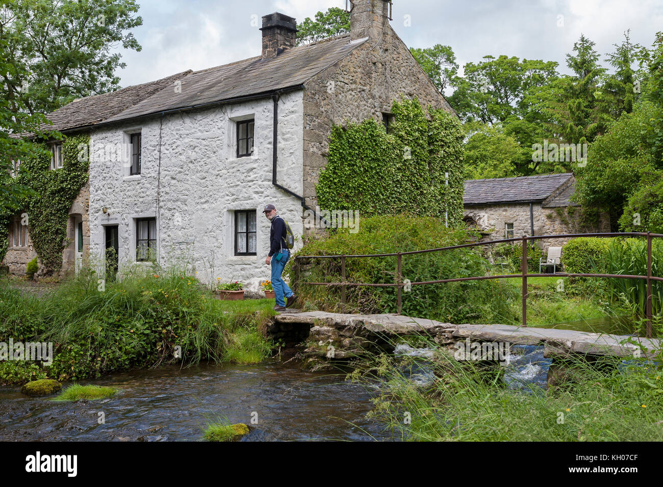 Clapper bridge over Malham Beck, Malham, North Yorkshire, England, UK ...