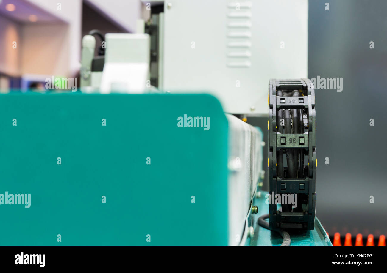 flexible power wire tray moving mechanism detail in an industrial ...