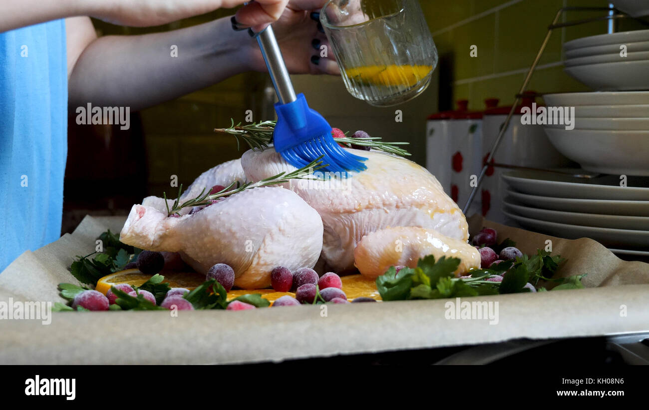 Female Hands Brushing Whole Raw Chicken With Roasting Sauce in Roasting ...