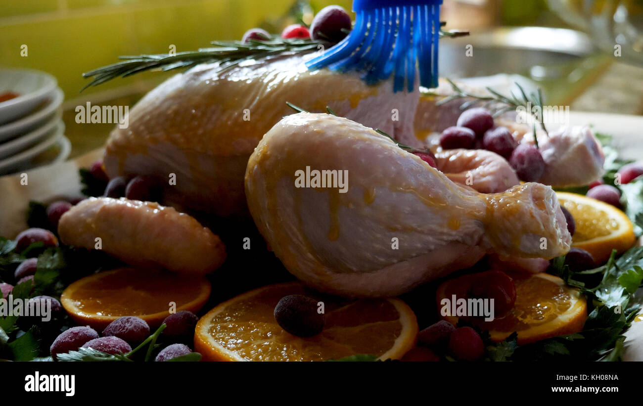 Female Hands Brushing Whole Raw Chicken With Roasting Sauce in Roasting ...