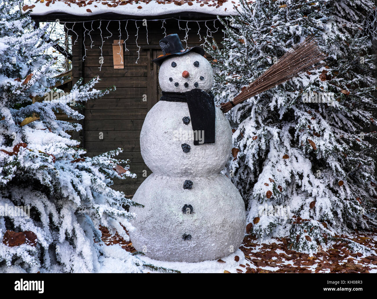 Snowman in a winter forrest setting Stock Photo - Alamy