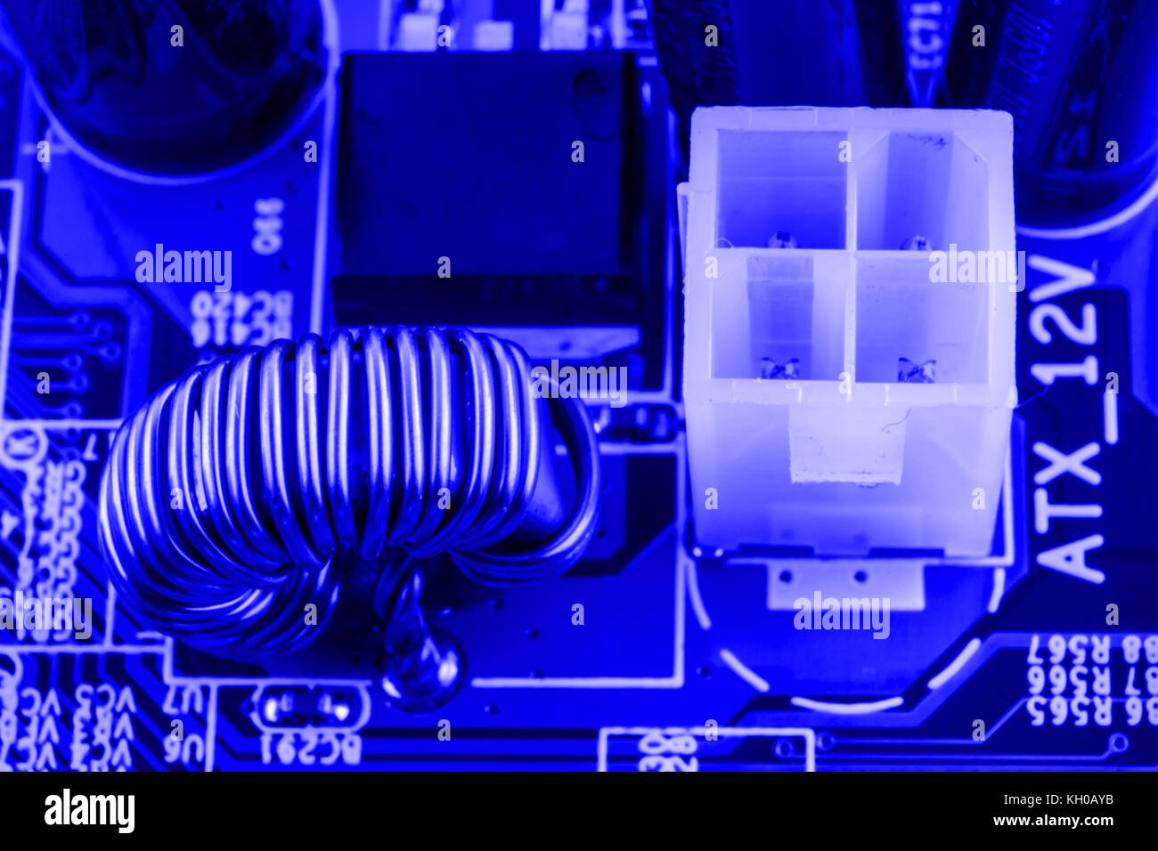 Integrated semiconductor microchip on blue circuit board representative ...