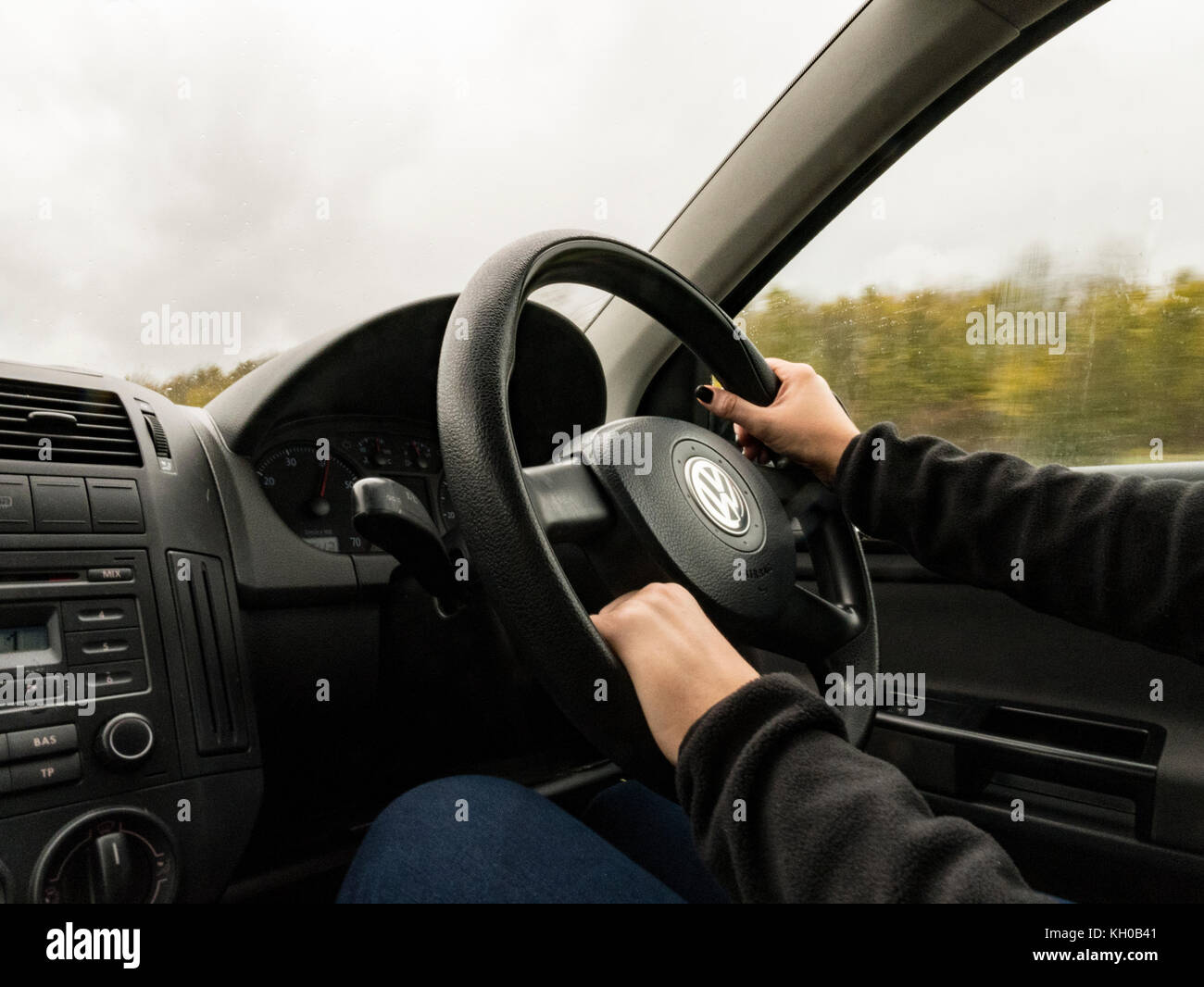 Women driving car in poor conditions down the motorway Stock Photo - Alamy