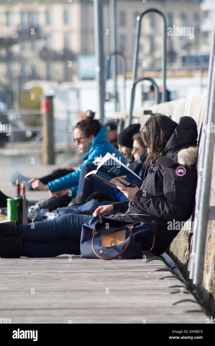 People eating and drinking by water Stock Photo - Alamy