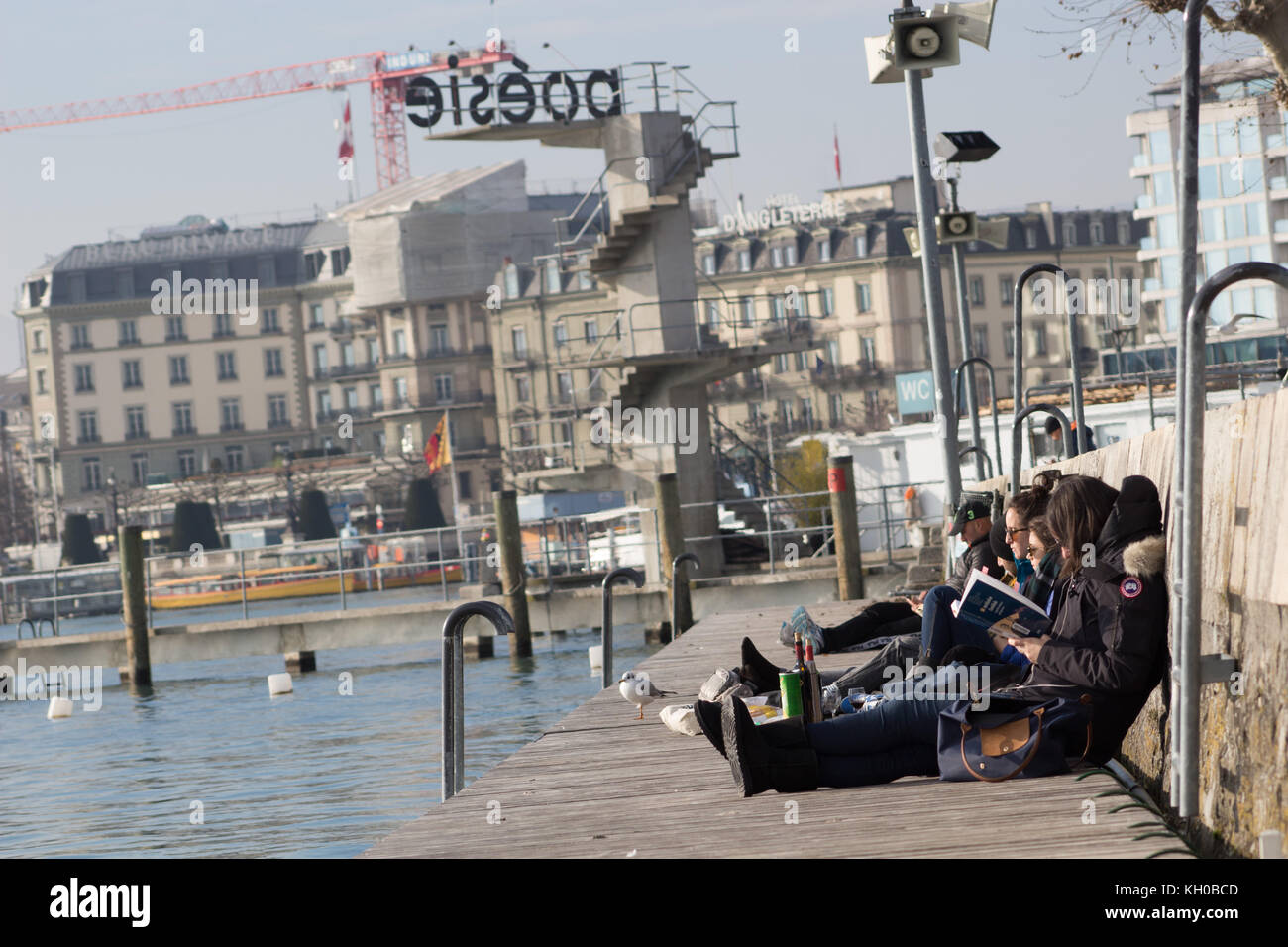 People eating and drinking by water Stock Photo - Alamy