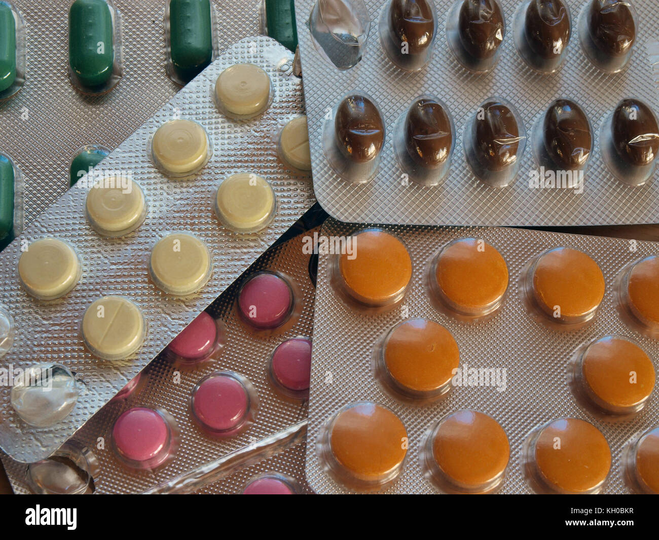 Plastic plates with color medicine tablets close up Stock Photo - Alamy