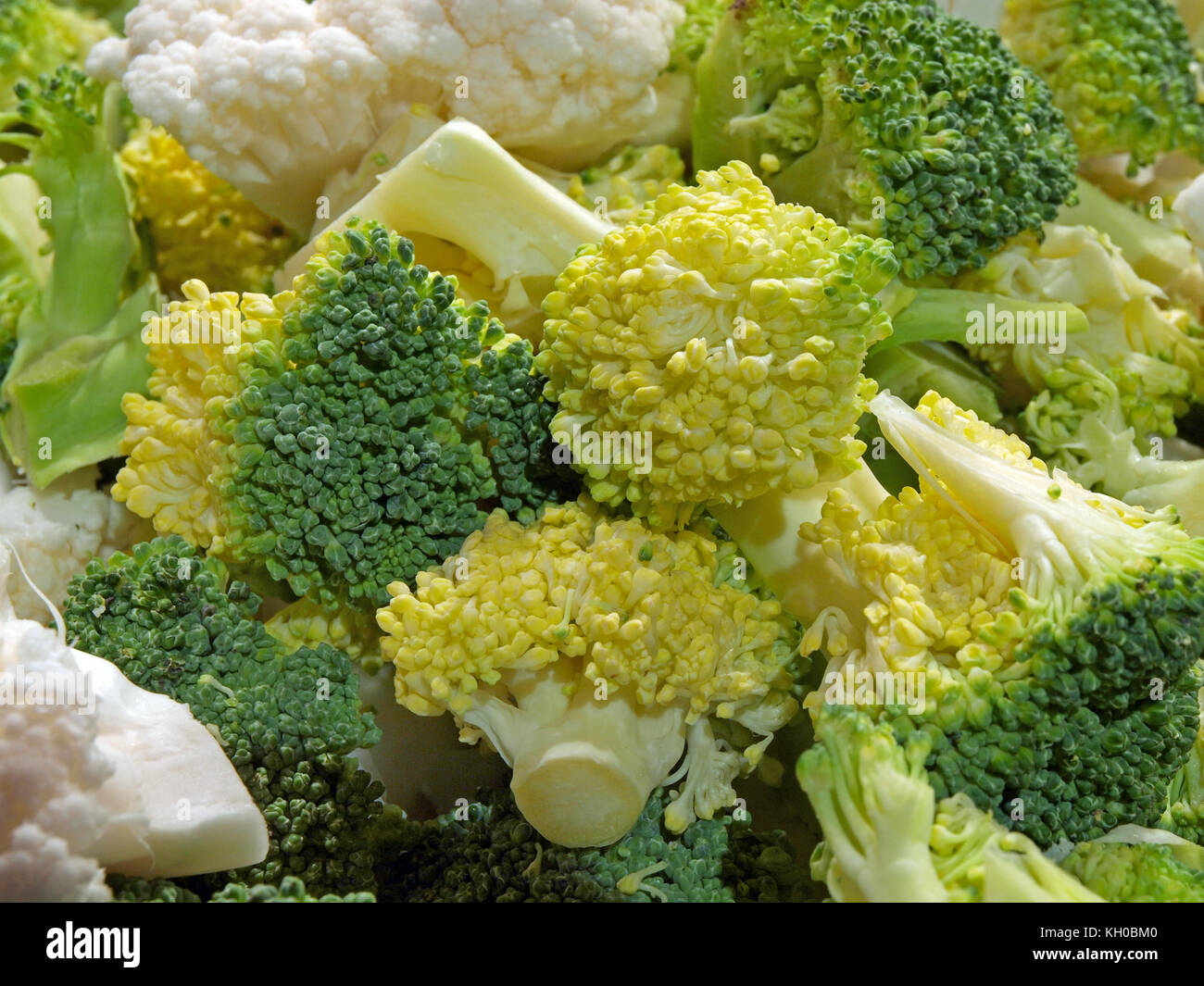 Pieces of chopped different color cauliflower close up Stock Photo - Alamy