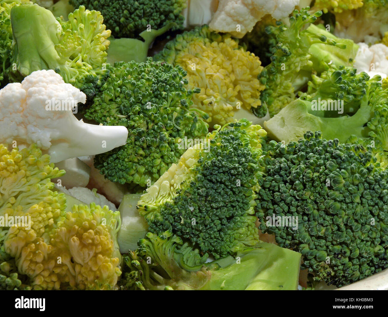 Pieces of chopped different color cauliflower close up Stock Photo - Alamy