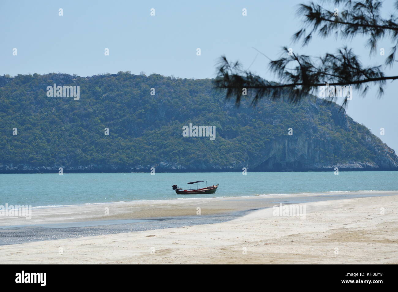 fishery boat floating on beach in sunny day Stock Photo - Alamy