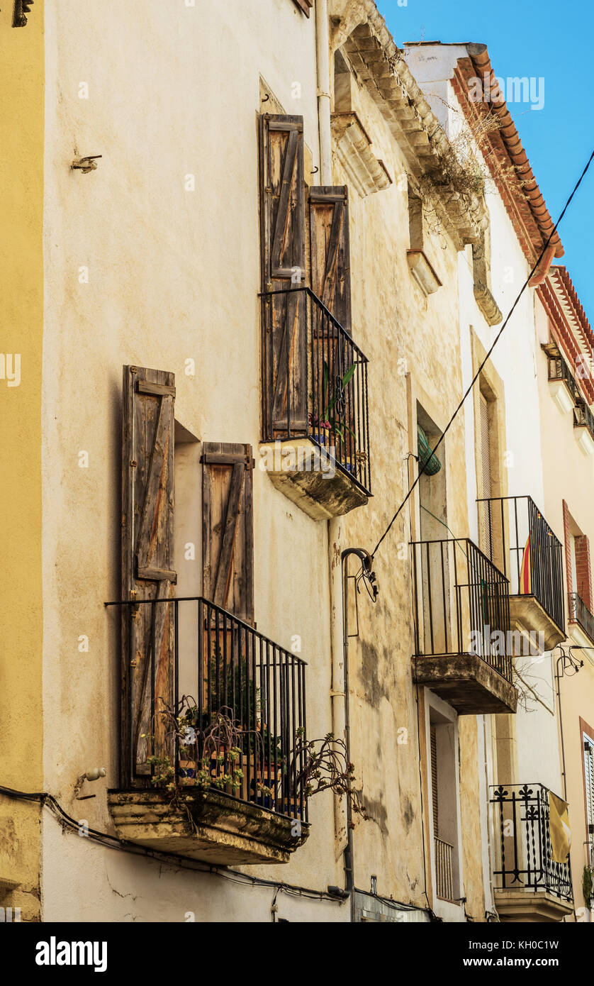 Stylish balcony with a metal railing, solid architectural element, a ...