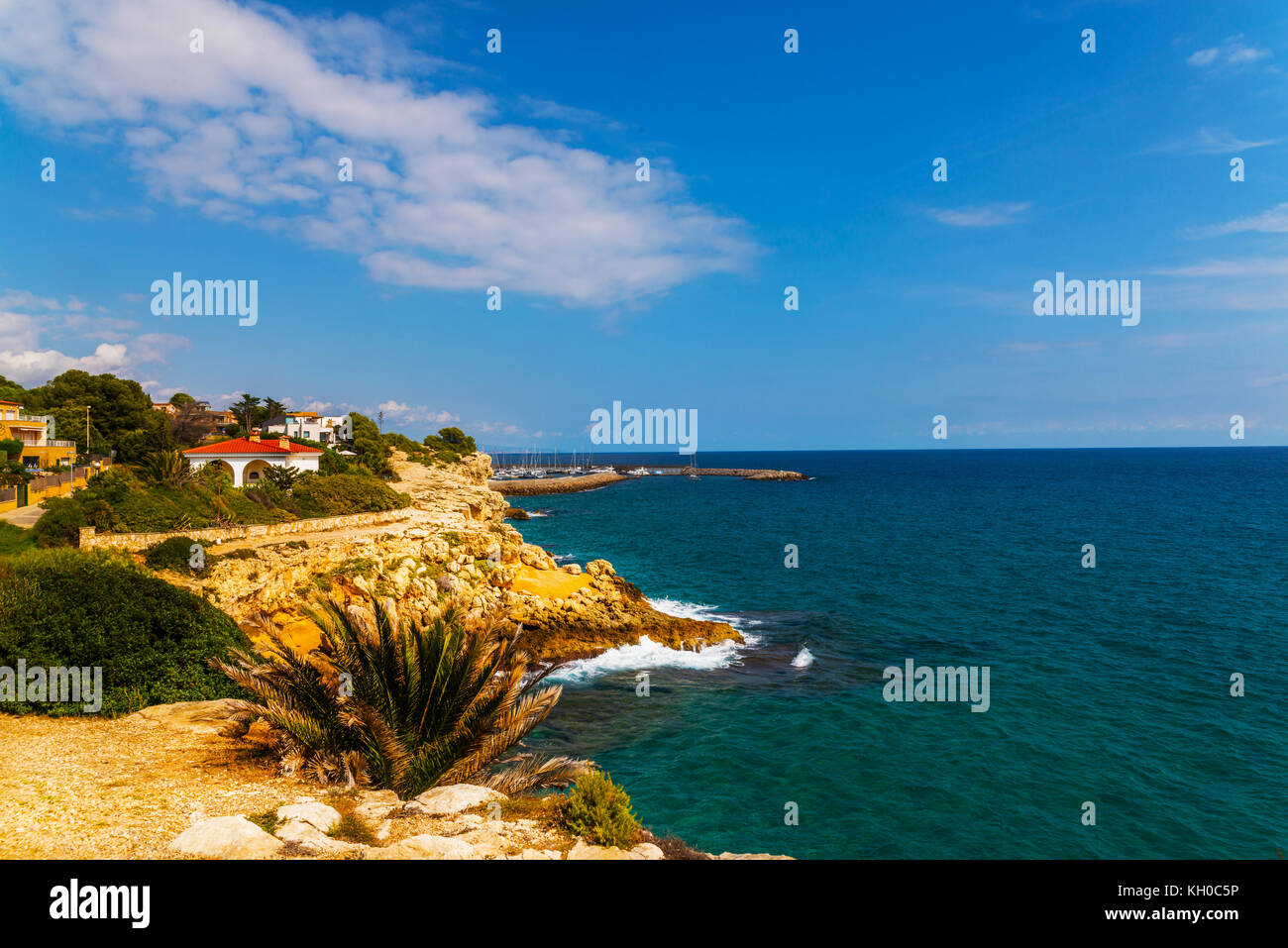 high cliff above the sea, summer sea background, many splashing waves ...