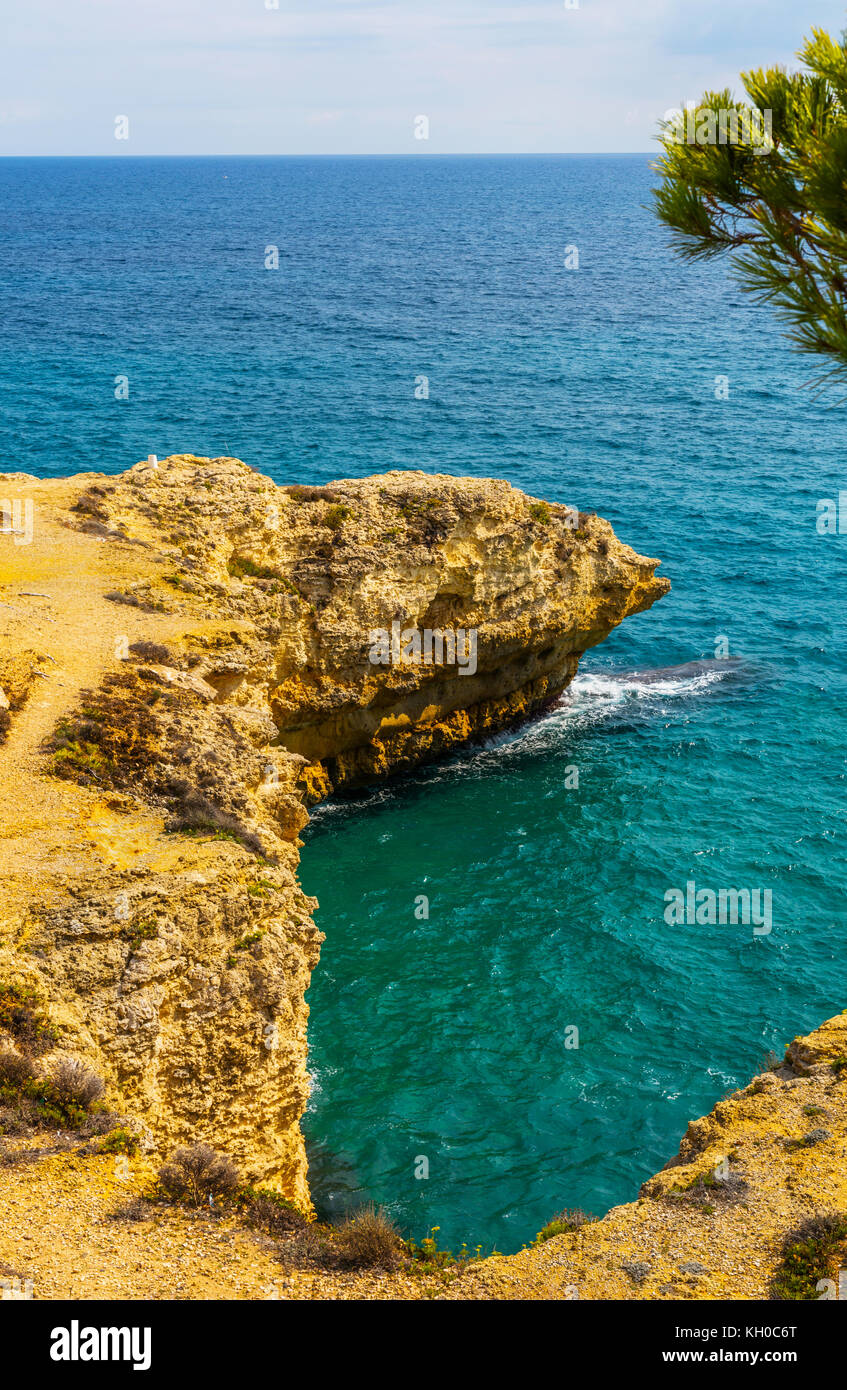 high cliff above the sea, summer sea background, many splashing waves ...