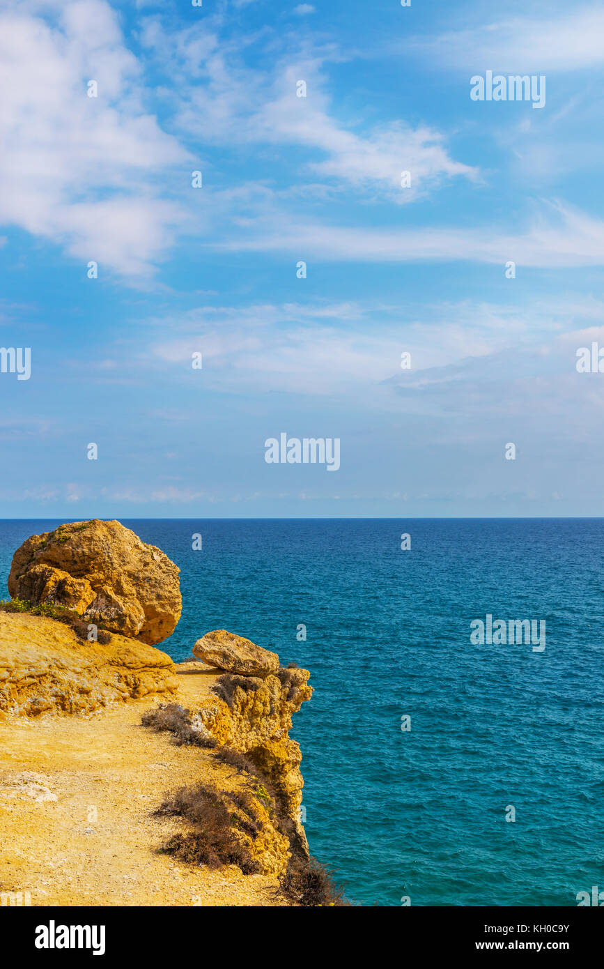 high cliff above the sea, summer sea background, many splashing waves ...