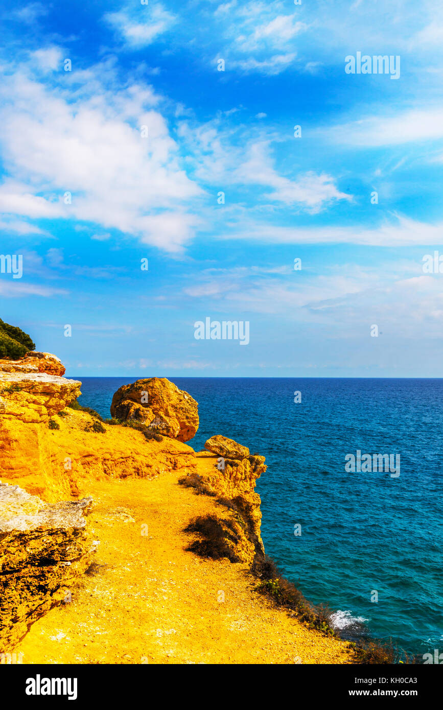 high cliff above the sea, summer sea background, many splashing waves ...