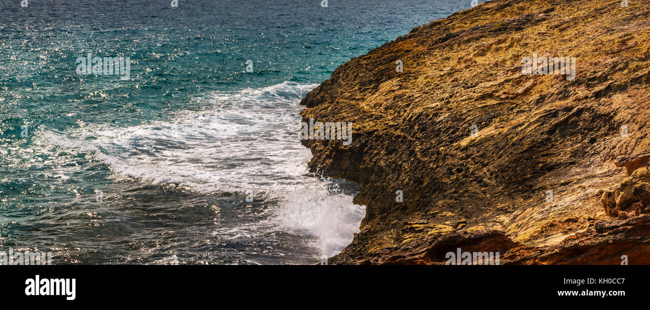 high cliff above the sea, summer sea background, many splashing waves ...