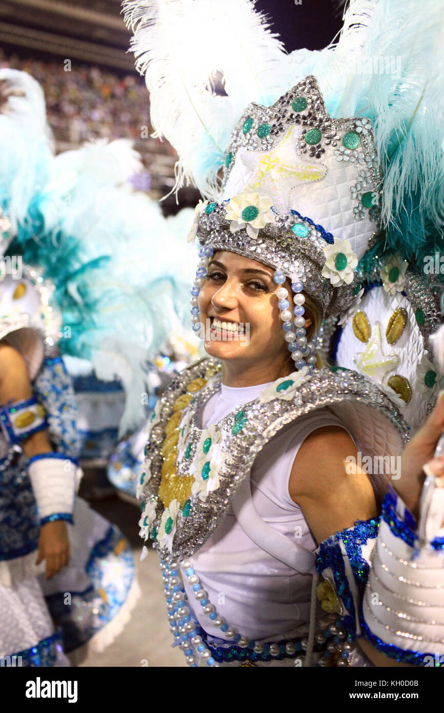 A delighted samba dancer from the Mangueira samba school wears a ...