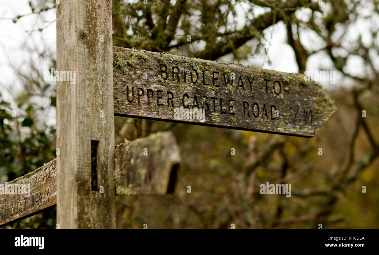 Wooden signpost marking a bridleway to Upper Castle Road near St Mawes ...