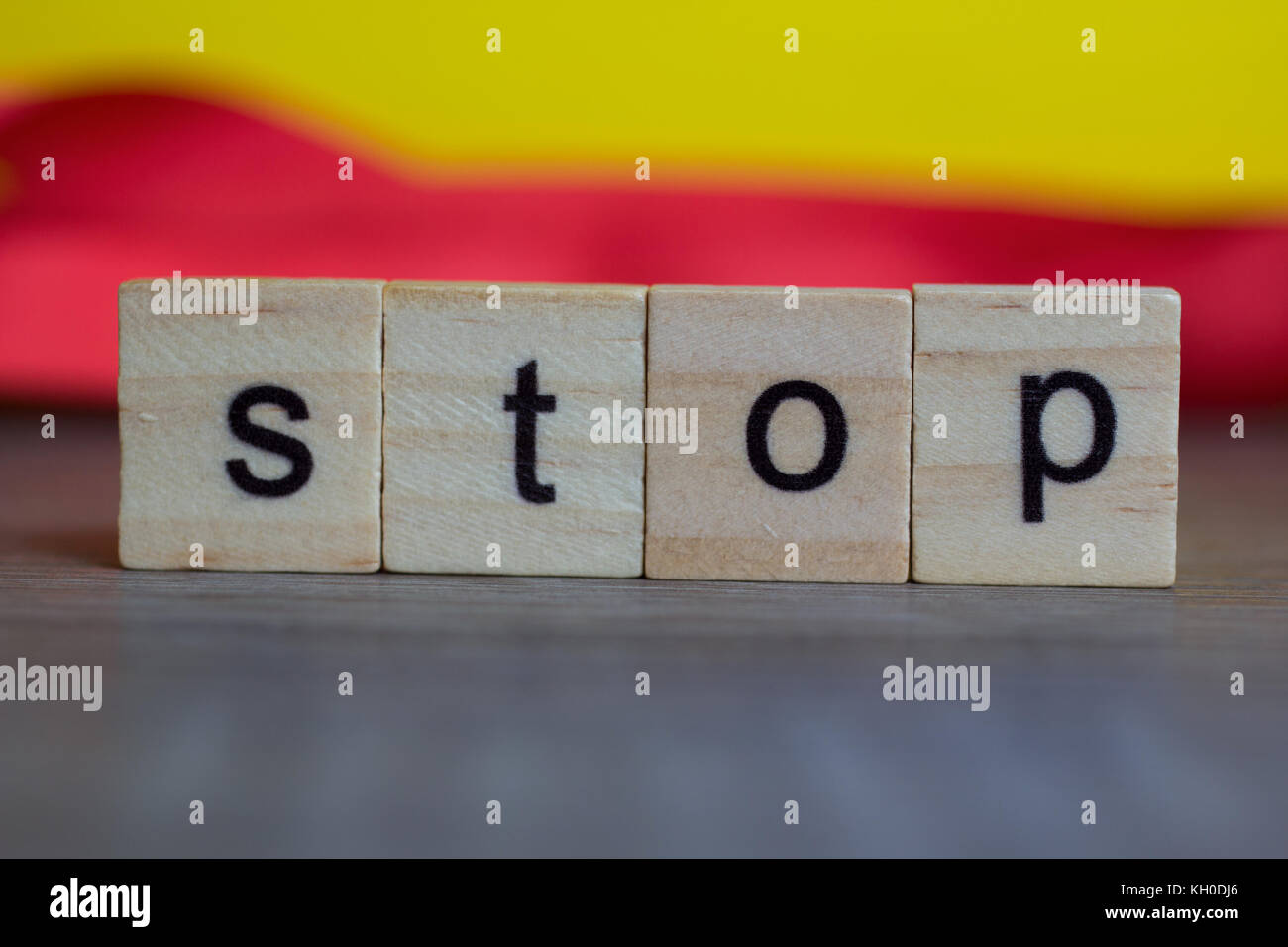 Stop word on wood cubes on table against colorful background Stock ...