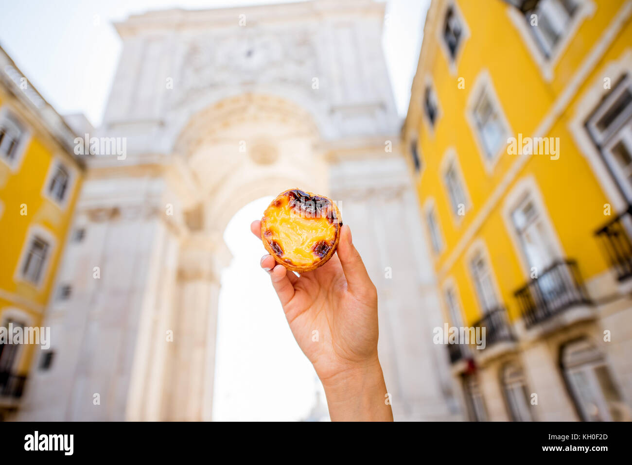 Holding pastel de Nata cake outdoors Stock Photo - Alamy