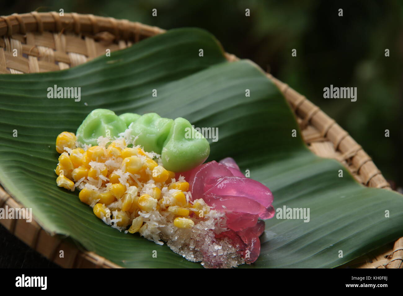 Three kinds of Jaja Bali, or Balinese cake, served together on woven ...