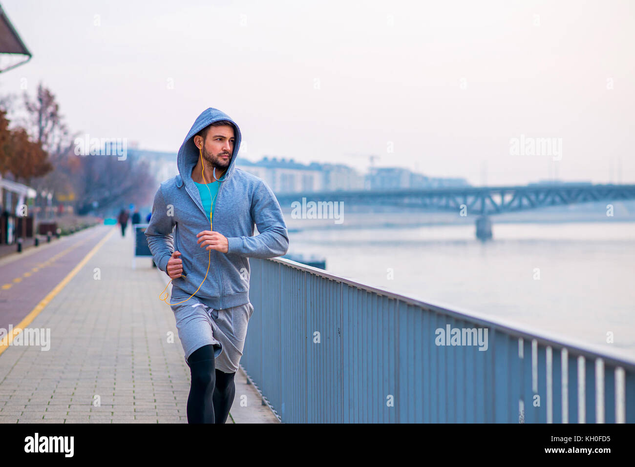 Attractive young man running athlete hi-res stock photography and ...