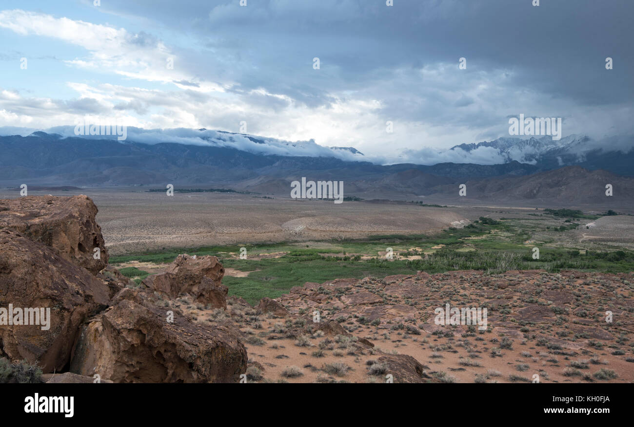 The Sierra Nevada Mountains stand over the dramatic Volcanic Tablelands ...