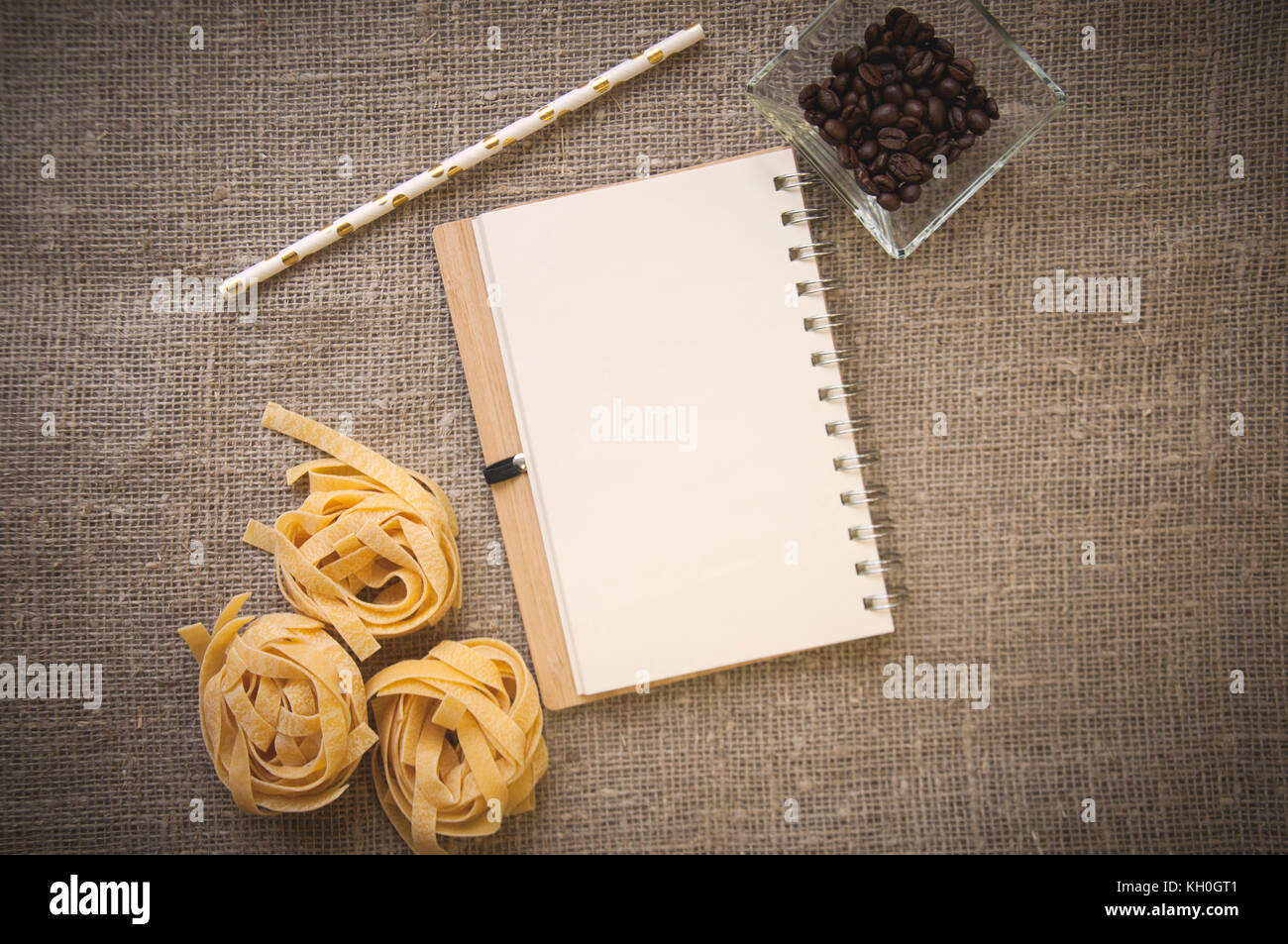 notebook, raw fettuccine pasta and coffee beans in bowl Stock Photo - Alamy