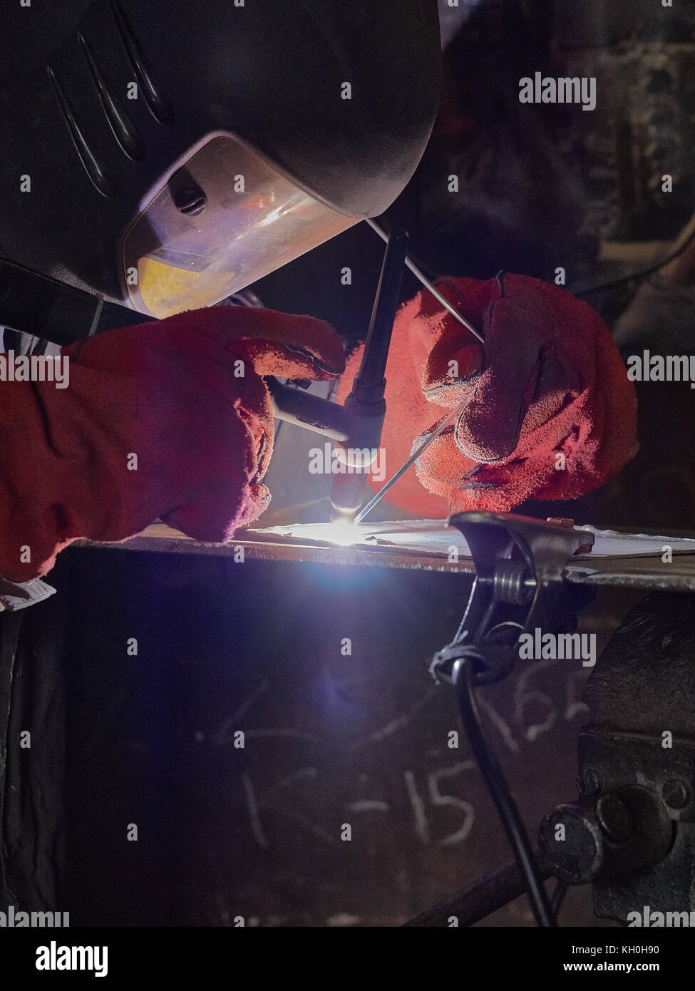 Welder working with argon welding Stock Photo - Alamy