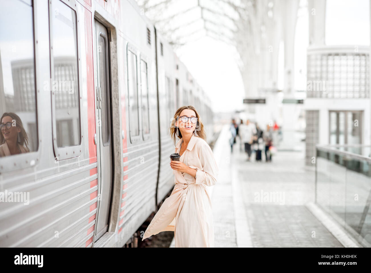 Woman at the railway station Stock Photo - Alamy