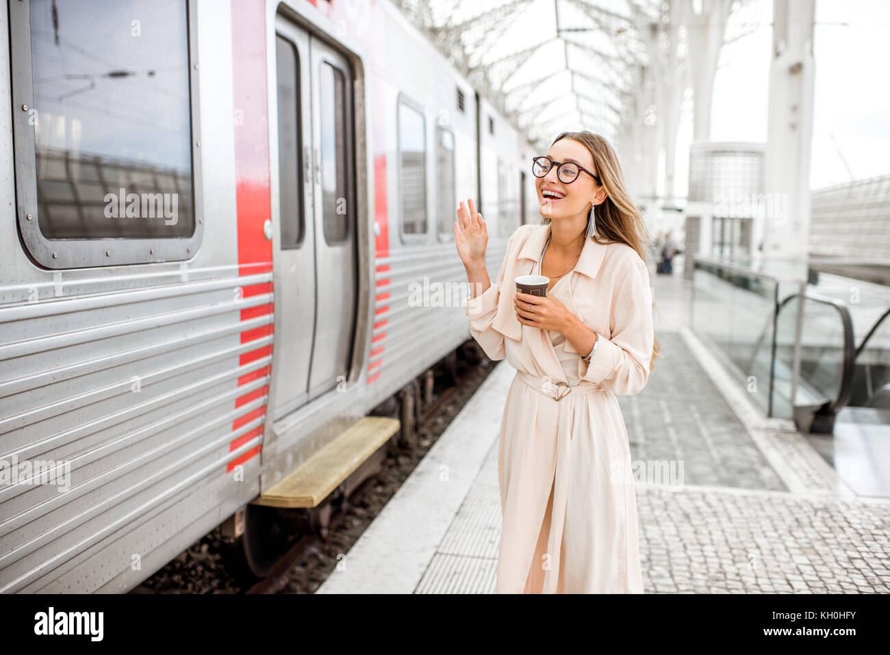 Woman at the railway station Stock Photo - Alamy